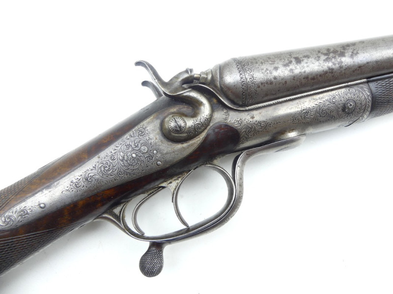 FUSIL DE CHASSE JUXTAPOSE HAMMERLESS A PLATINES.